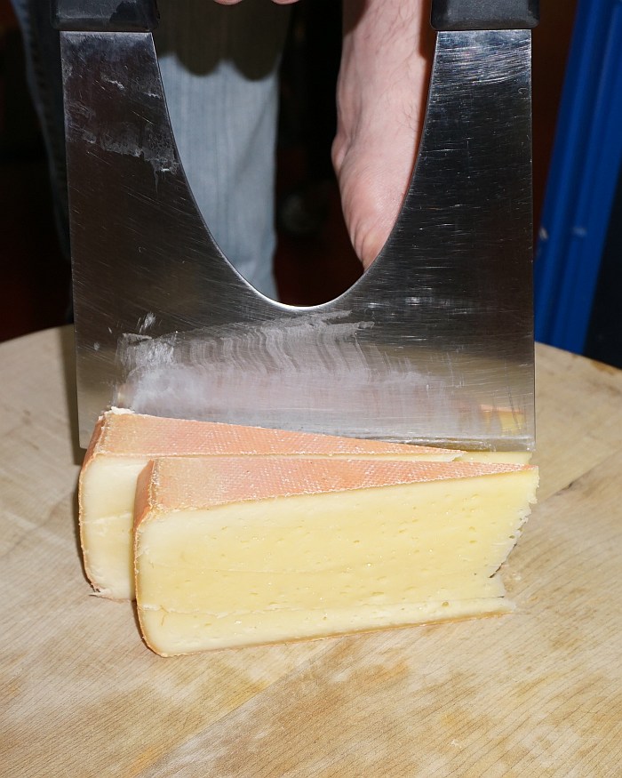 Buying cheese or buying cheese wheel - how do I cut out pieces of cheese